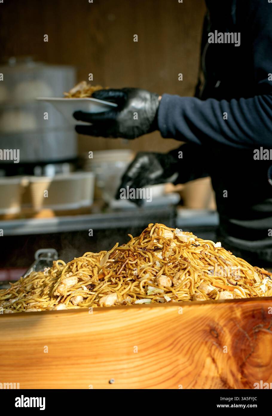 Street food festival in Europe. Asian fast food at market stall. Pile ...