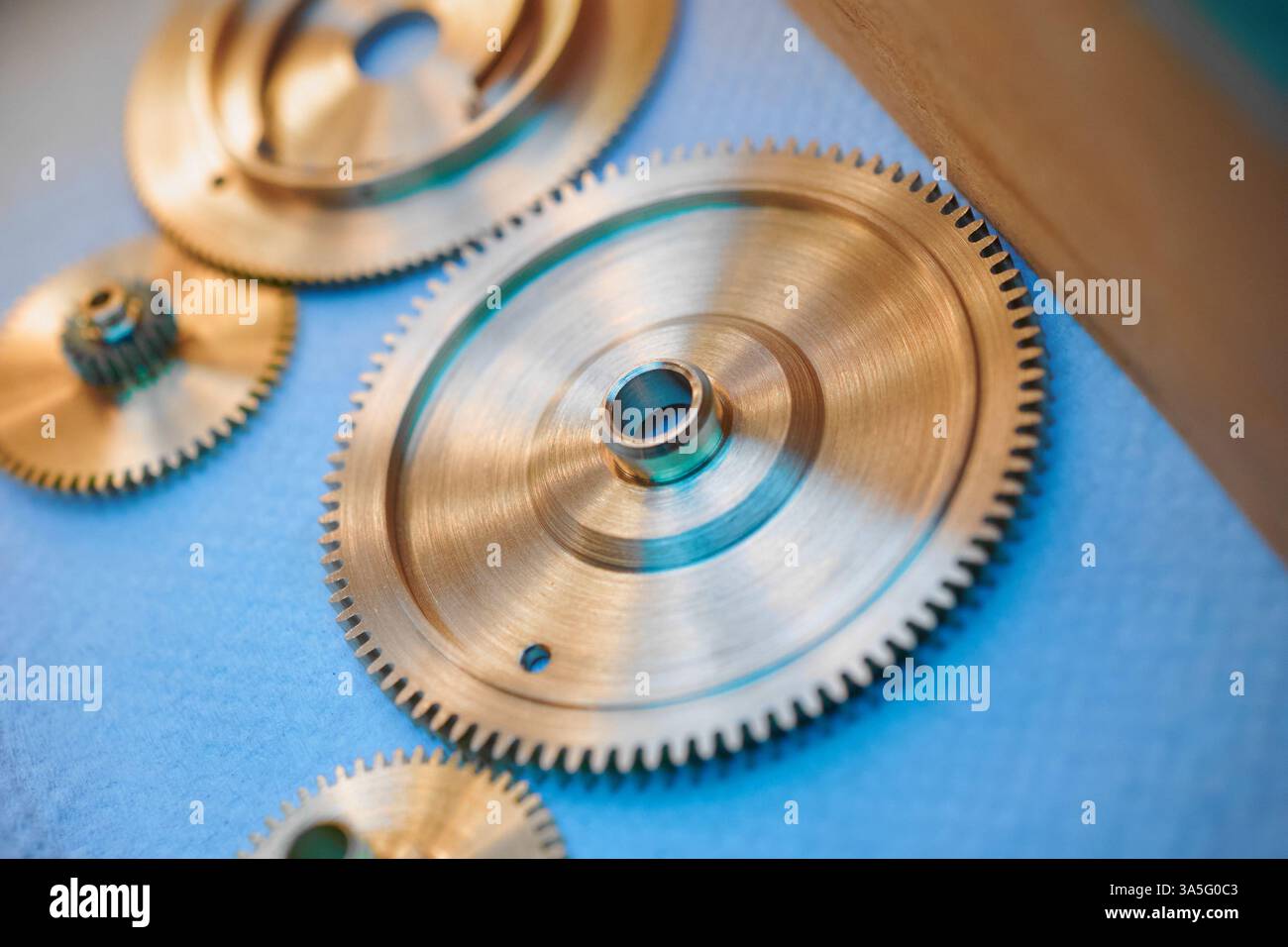 Intricate brass cogwheels and gears showcase the beauty of clockwork ...