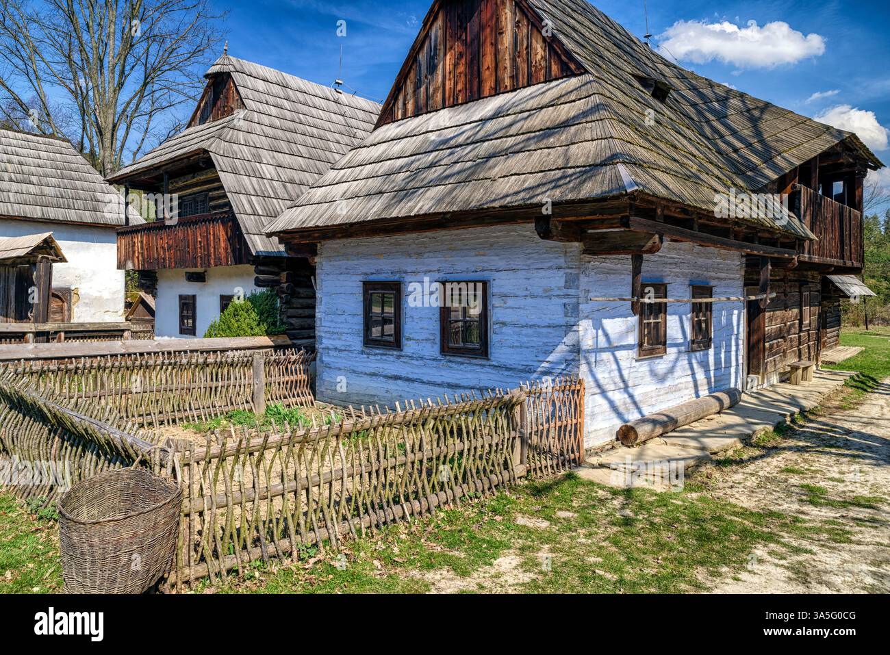 Colorful wooden rural cottages in musem of the Slovak village in Martin ...