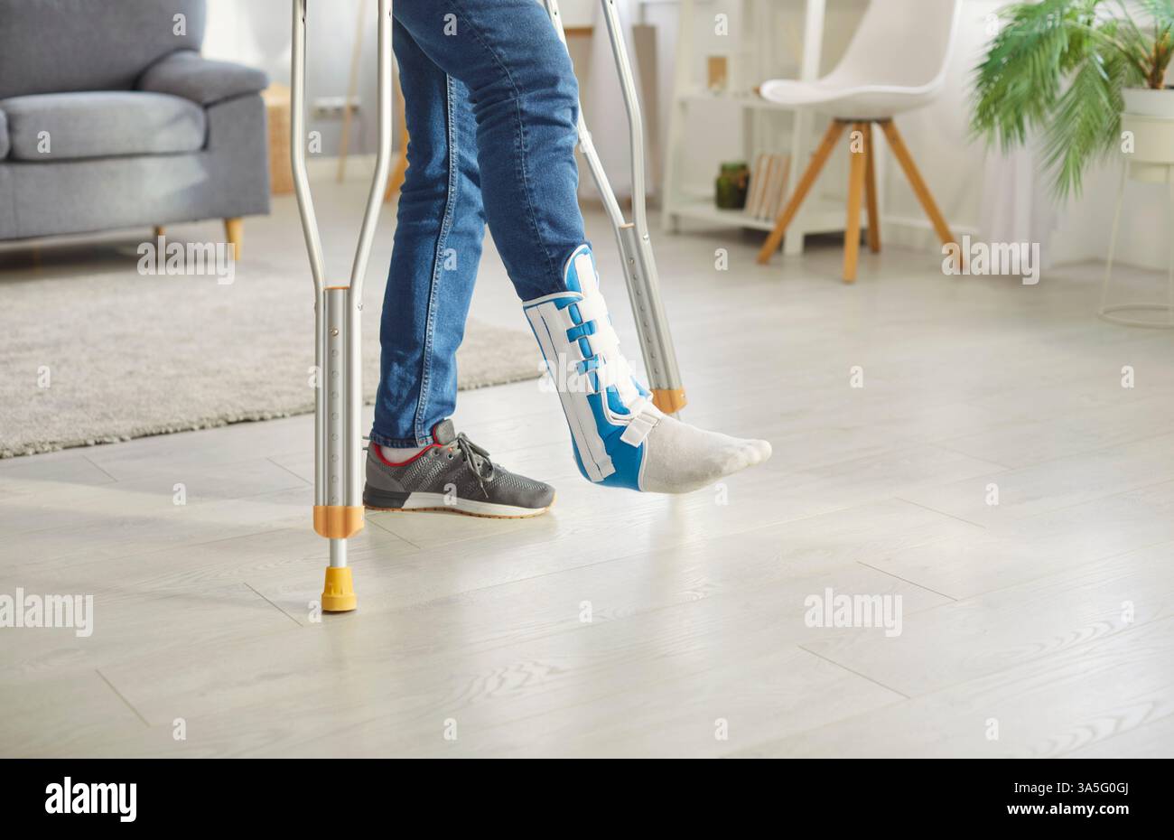 Unrecognizable person with broken leg wearing fracture fixator, walking ...