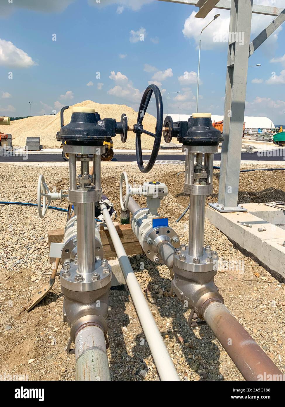 Industrial pipeline system with large manual valves at a construction ...