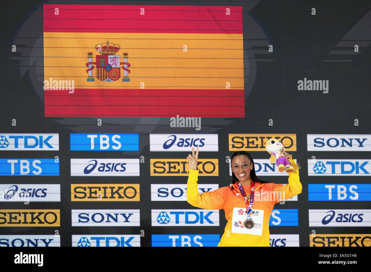 Ana Peleteiro-Compaore, of Spain, poses on the podium after winning the ...