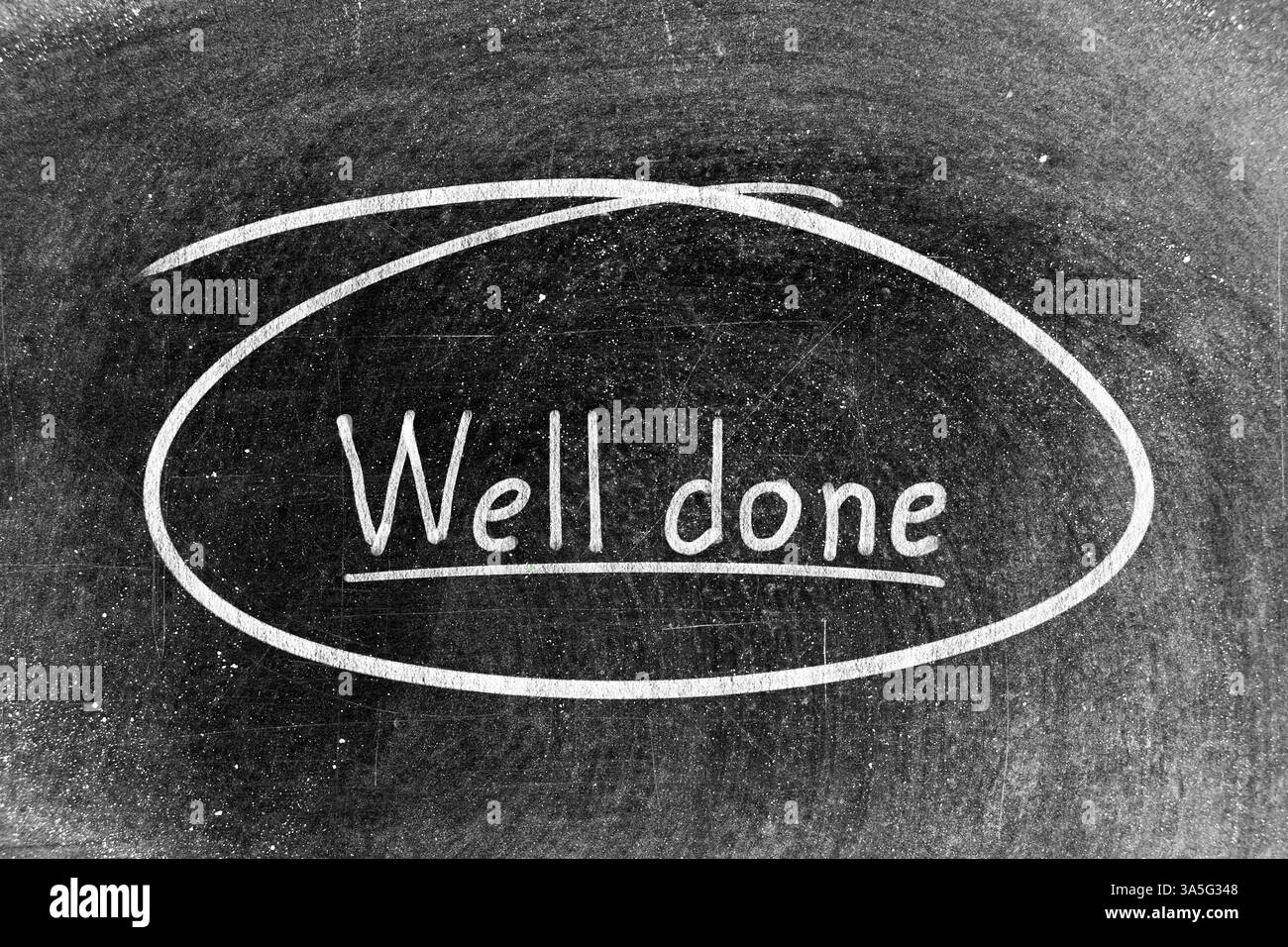 White chalk hand writing in word well done and circle shape on ...