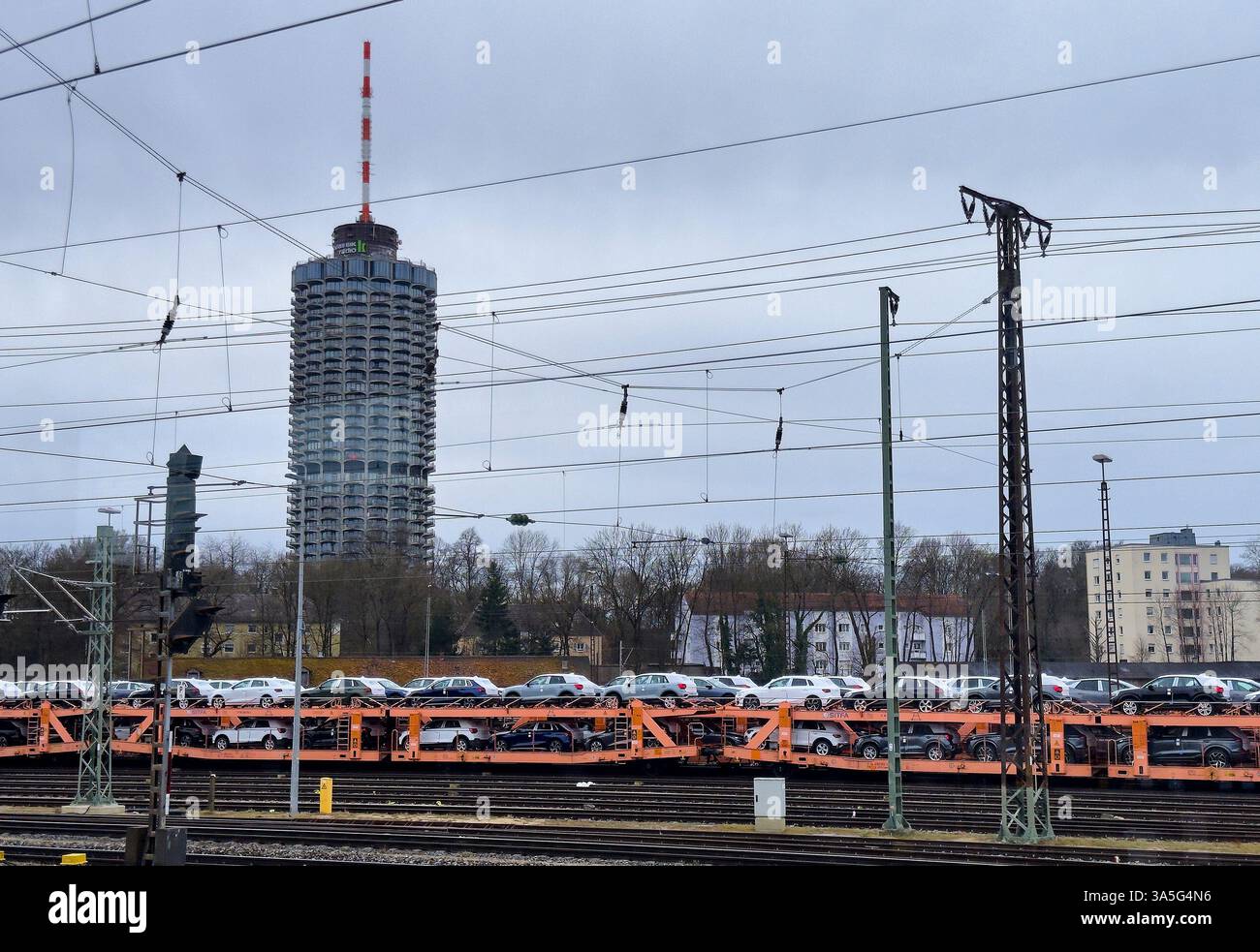 Car train with new AUDI vehicles on the platform at train station ...