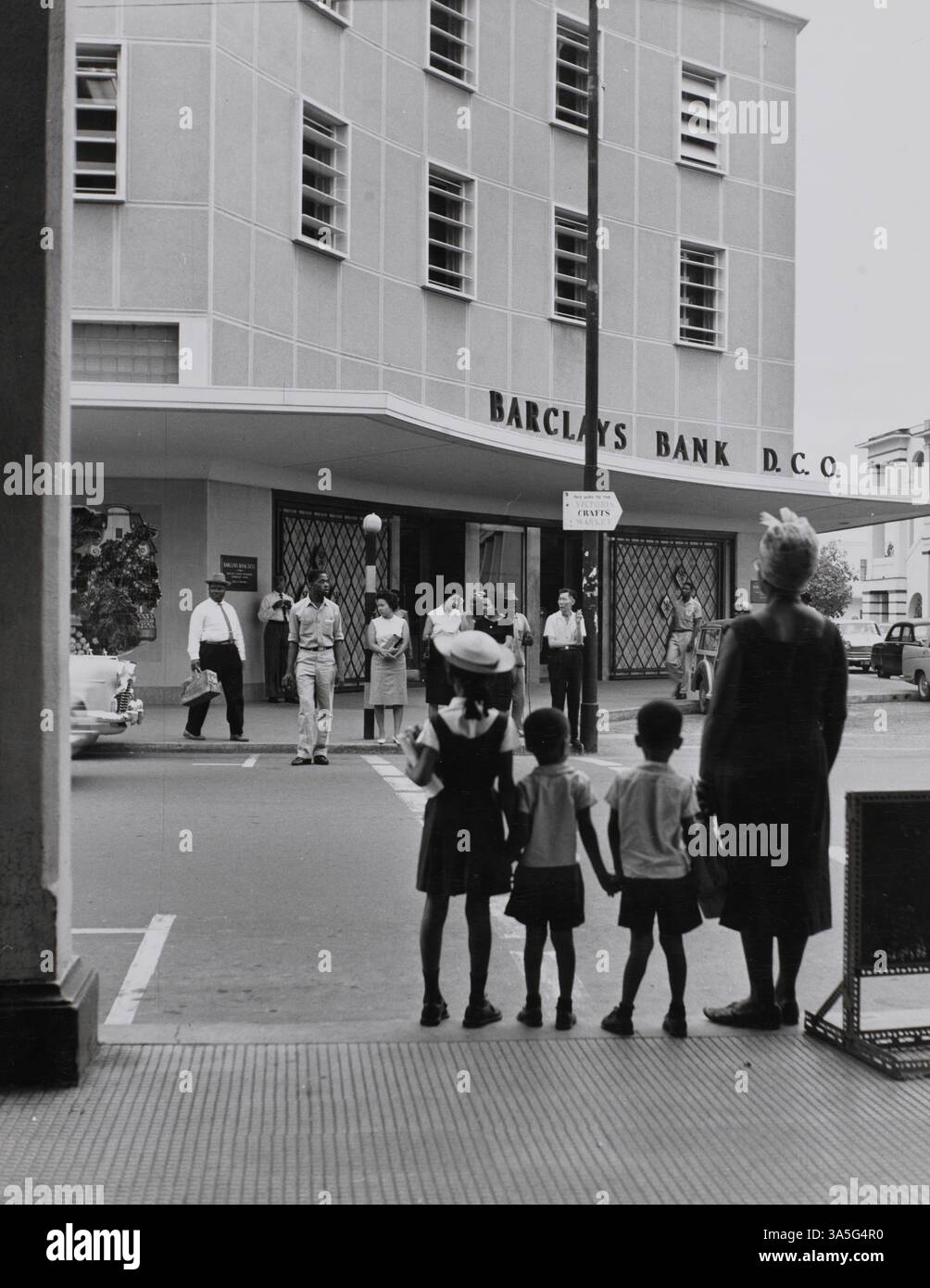 Jamaica. King Street in Kingston. Barclays Bank D.C.O. Mother and 3 children Stock Photo - Alamy