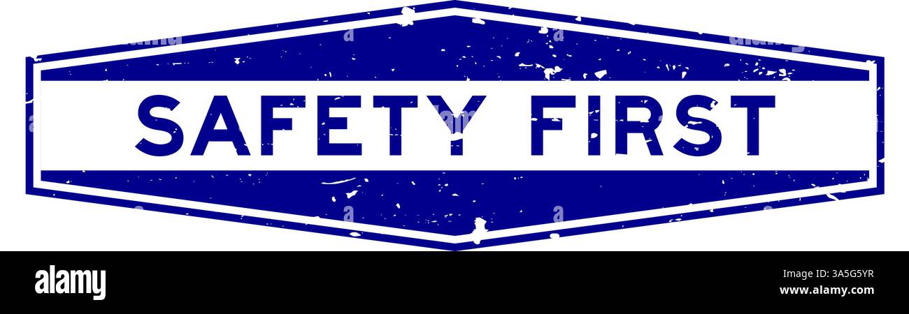 Grunge blue safety first word hexagon rubber seal stamp on white ...