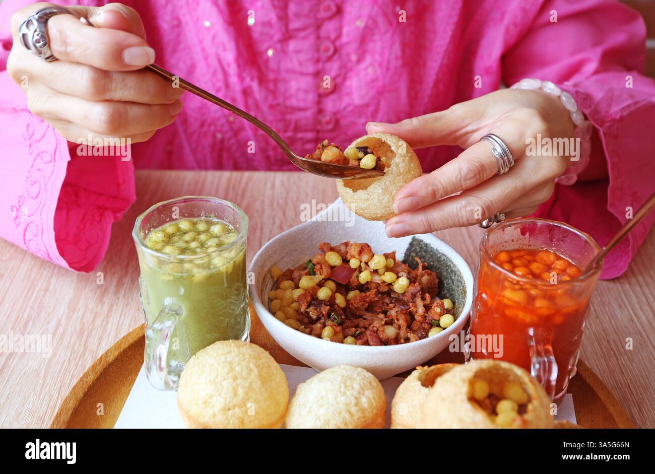 Pani Puri, a popular Indian snack made of small fried semolina shell ...