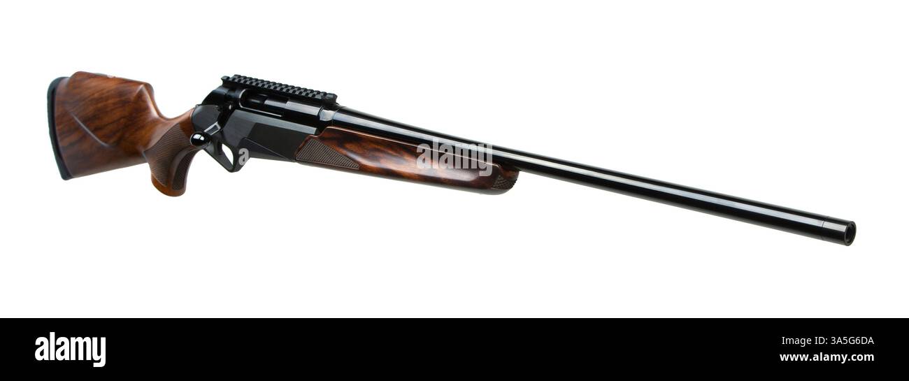 A hunting rifle with a polished wooden stock and a long barrel ...