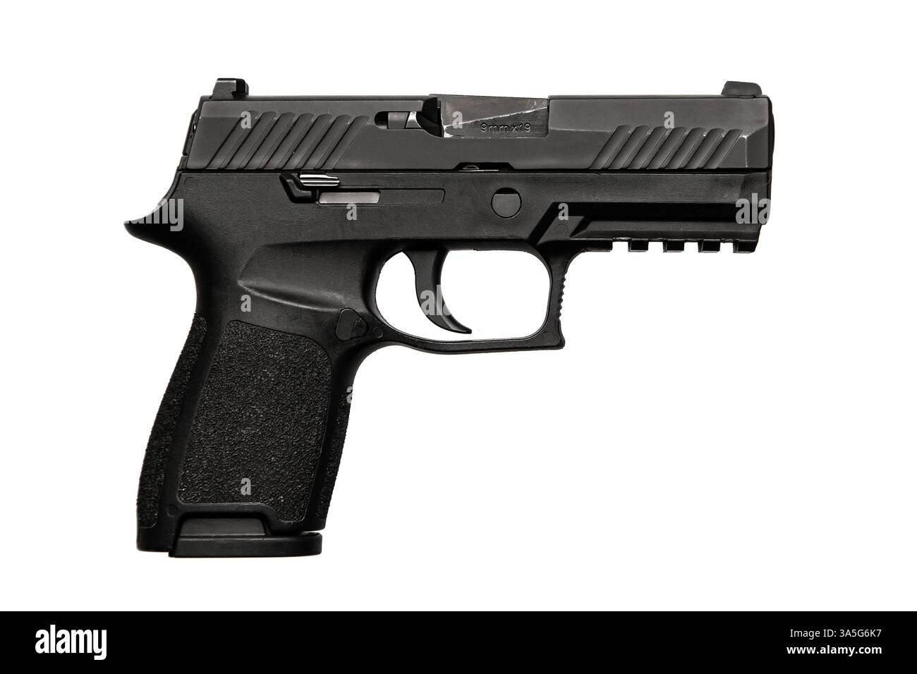 A black semi-automatic handgun with a sleek slide, textured grip ...