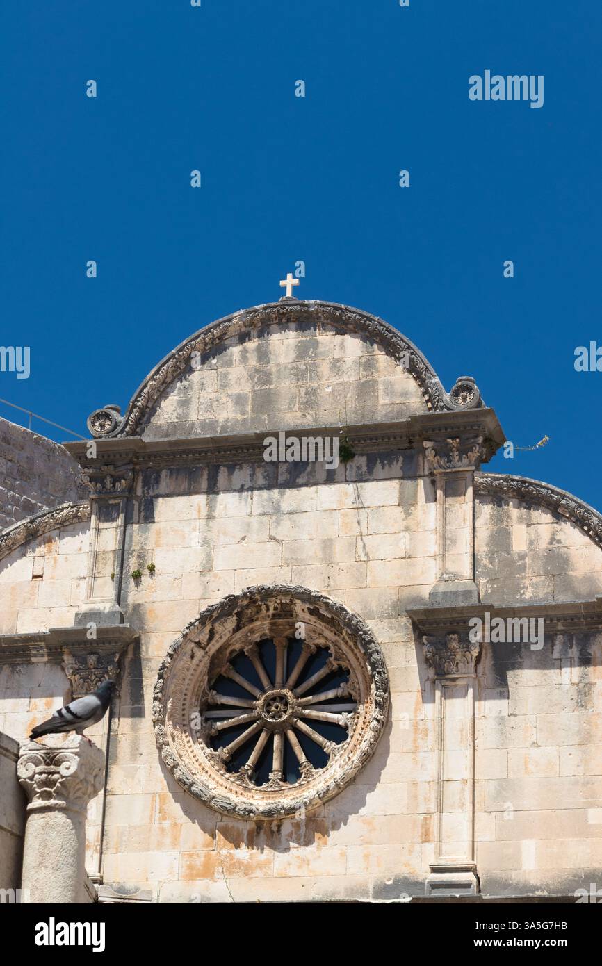 A scenic view of a historic stone church facade featuring intricately ...
