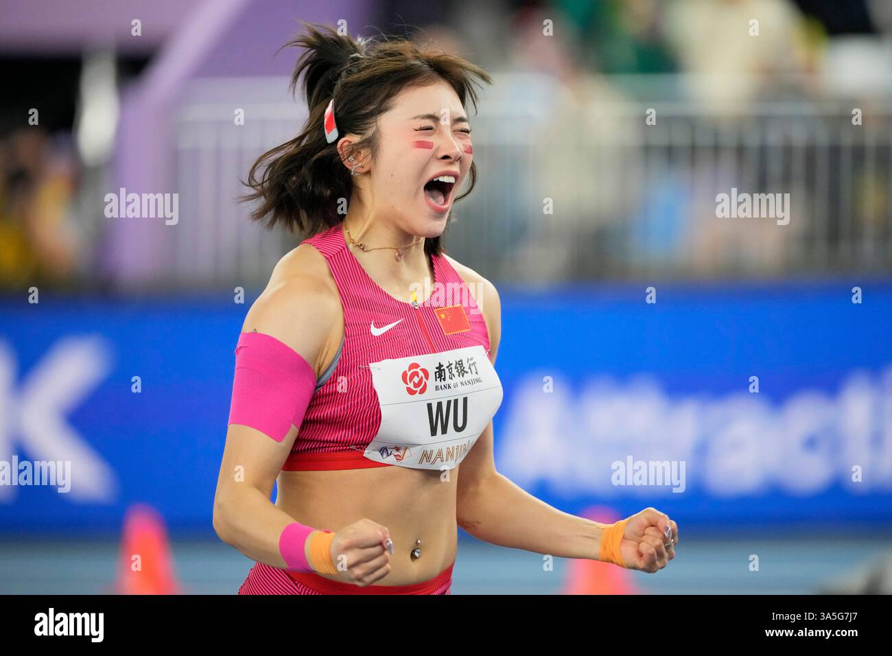 Wu Yanni, of China, celebrates after setting a new national record ...