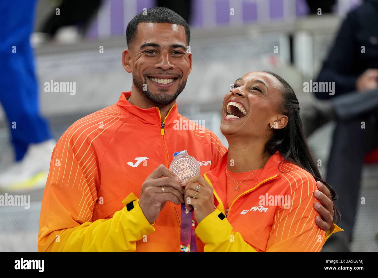 Ana Peleteiro-Compaore, of Spain, poses with her husband Benjamin ...
