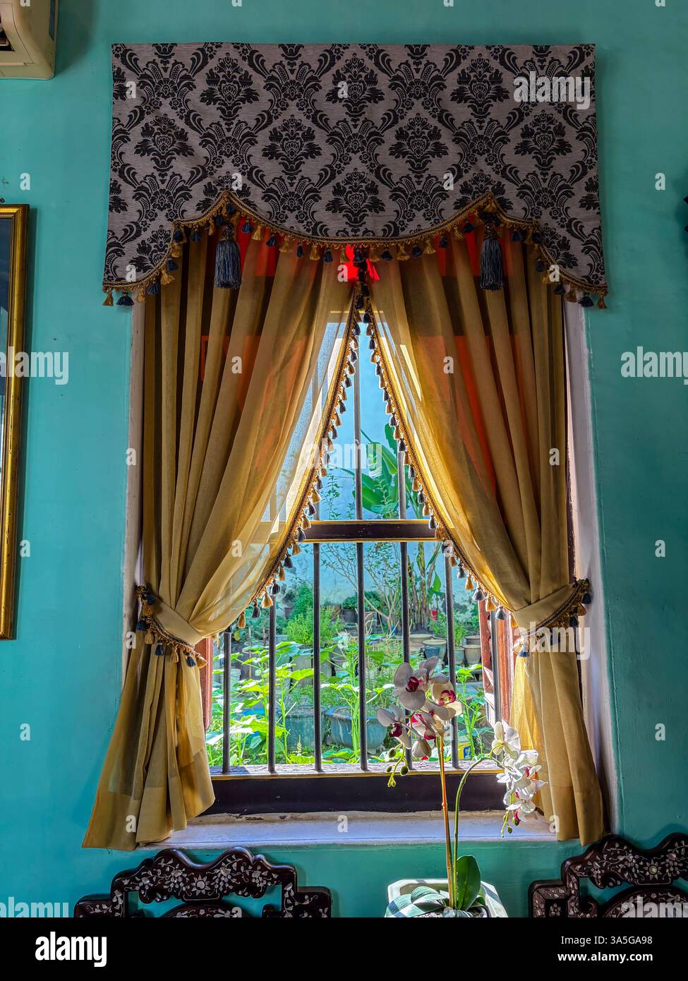 Intricately decorated window with curtains, at Pinang Peranakan Mansion ...
