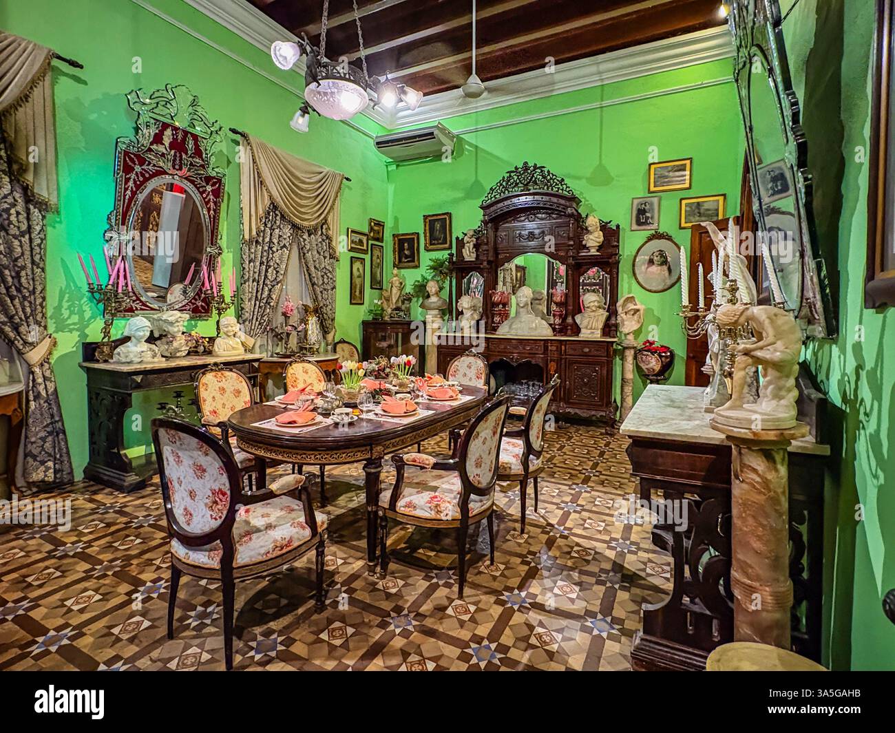 Opulent interior shot of the Peranakan Mansion dining room in ...