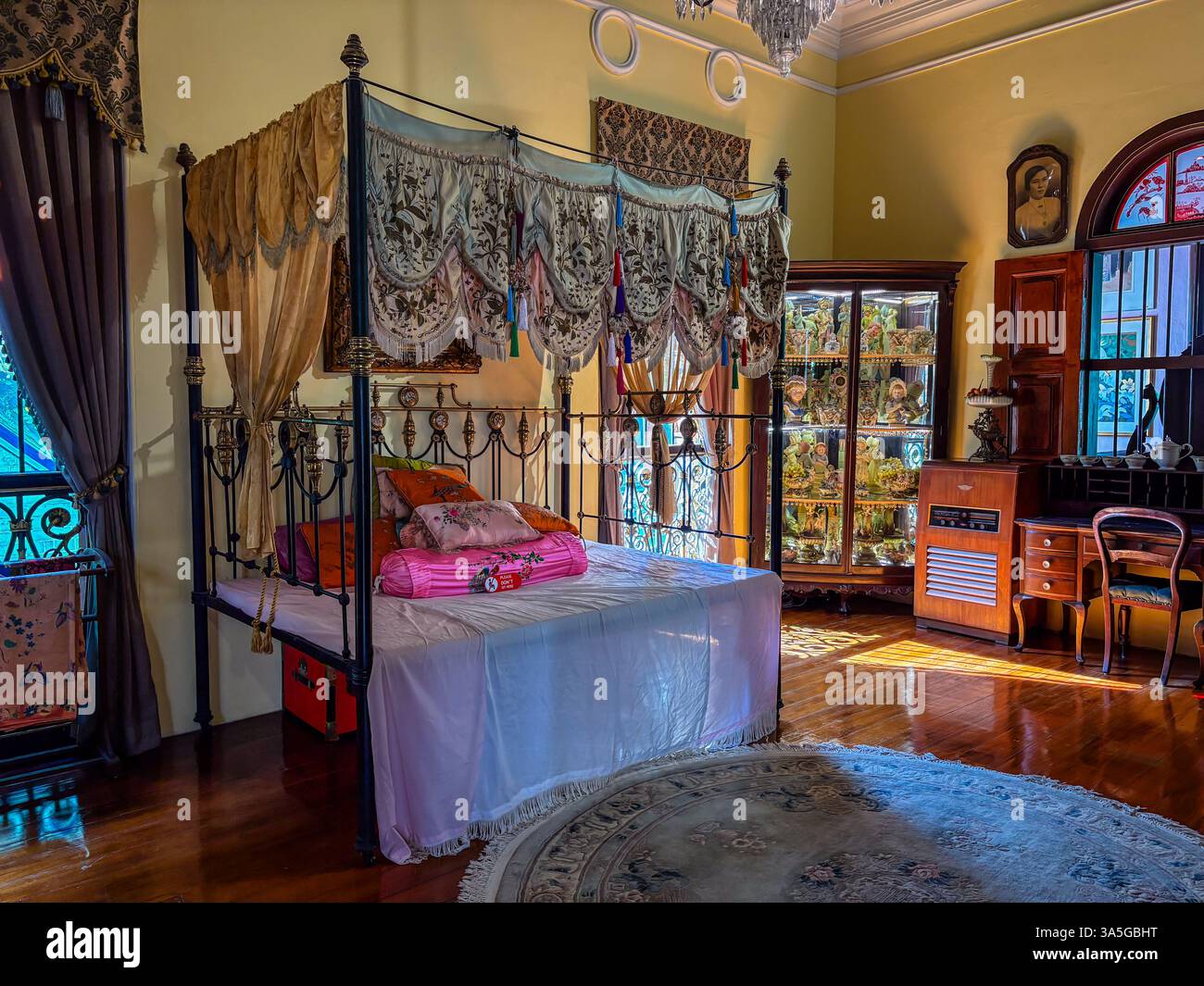 Inside the Penang Peranakan Mansion, a grand bedroom features ornate ...