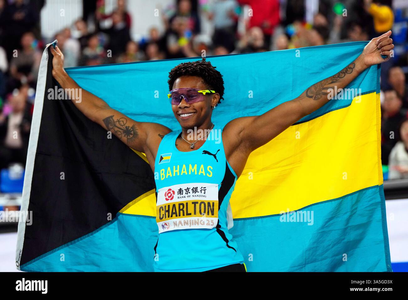 Devynne Charlton, of Bahamas, poses after winning the gold medal in the ...