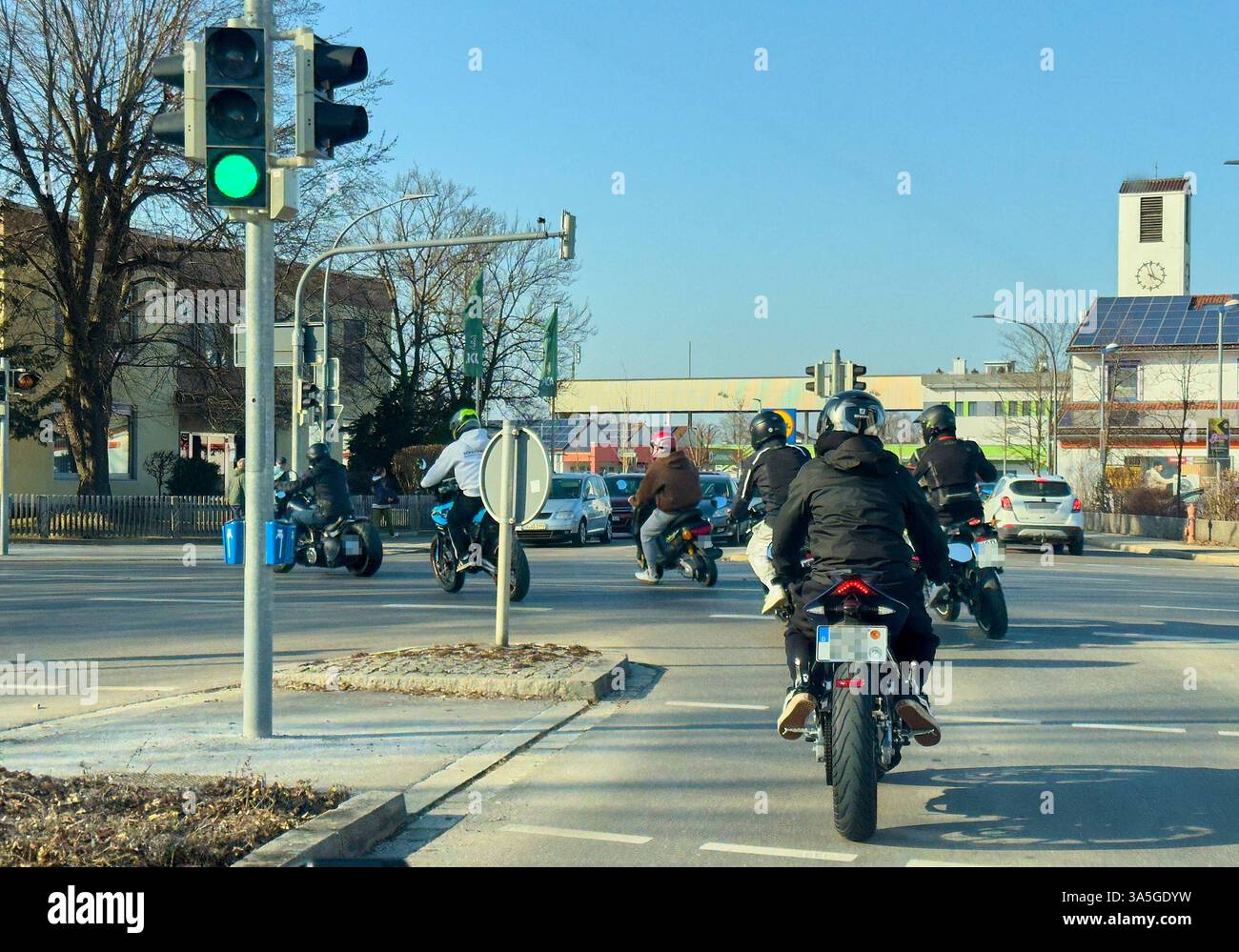 Group of motorcyclists riding their bikes on a sunny day in ...