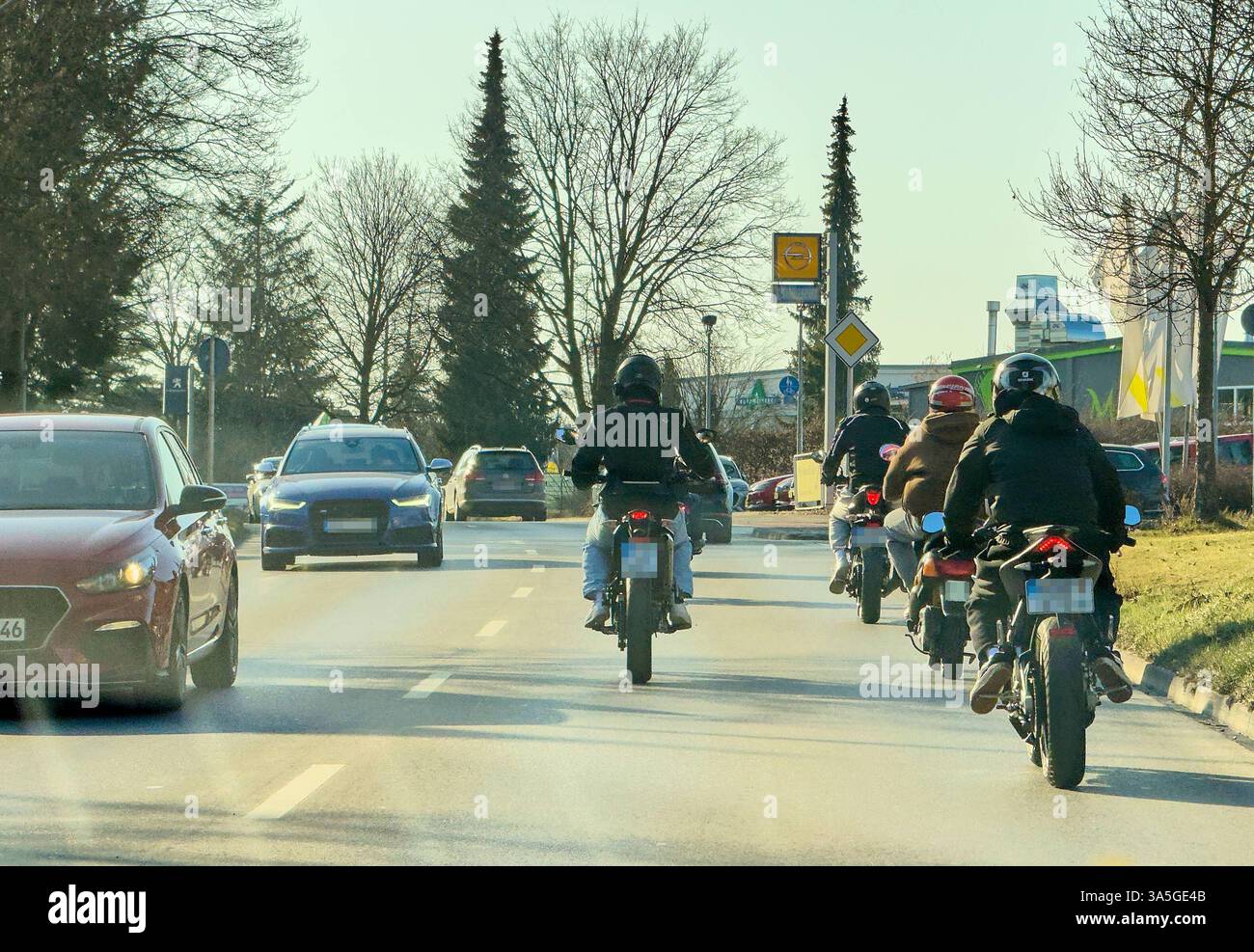 Group of motorcyclists riding their bikes on a sunny day in ...
