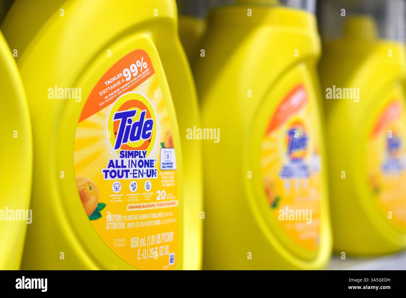 Plastic bottles of Tide liquid detergent on a retail store shelf Stock ...