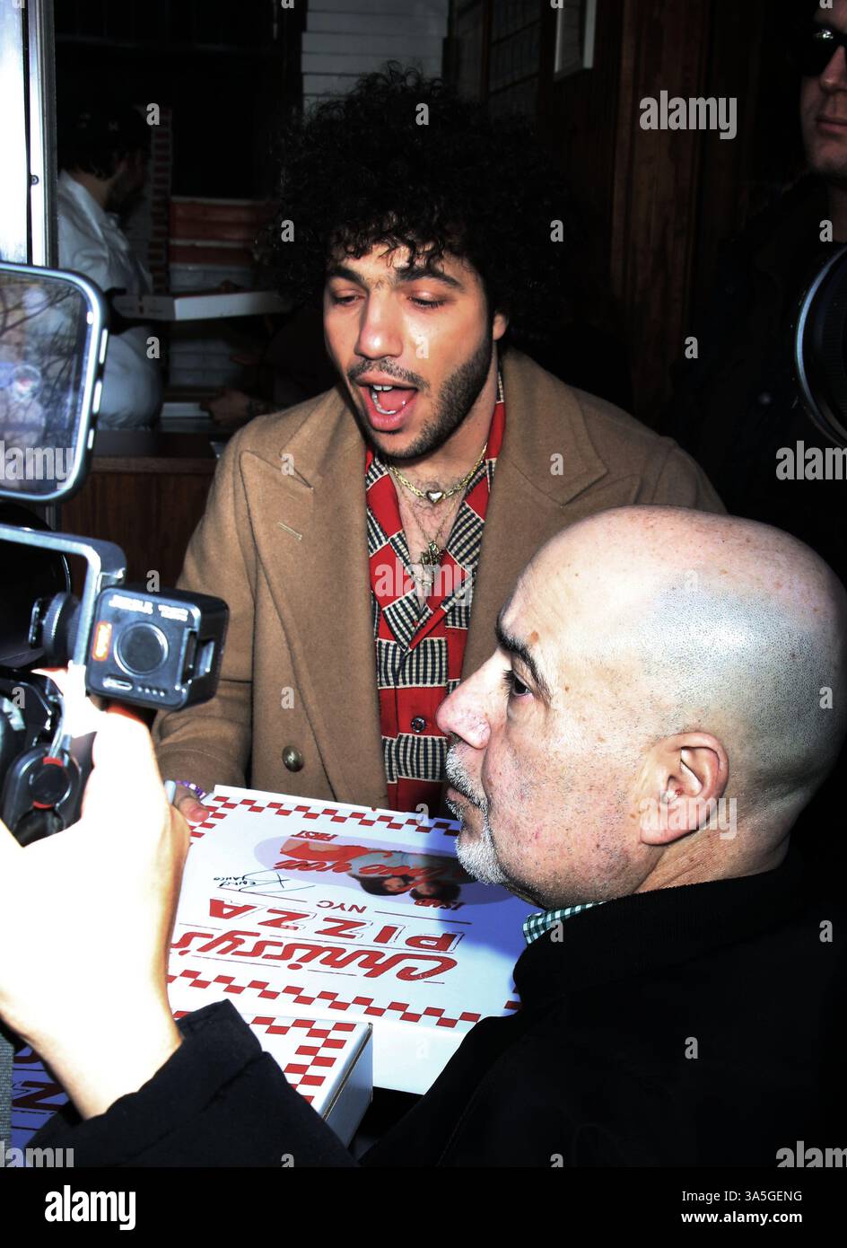 NEW YORK, NY- MARCH 21: Benny Blanco hands out pizza at Chrissy's Pizza ...