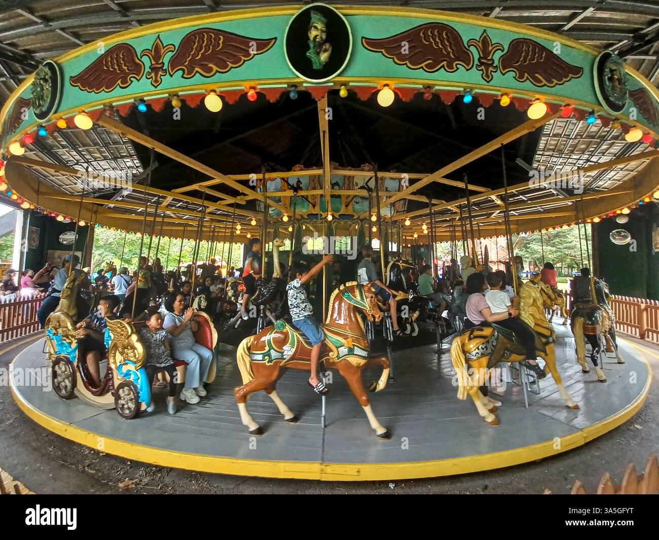 Toronto, ON, Canada – August 08, 2024: A classic carousel with colorful ...