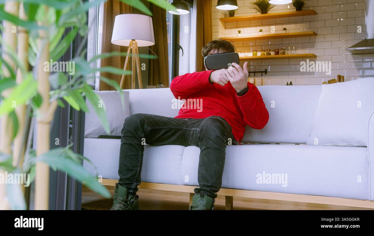 Person immersed in vr experience hi-res stock photography and images ...