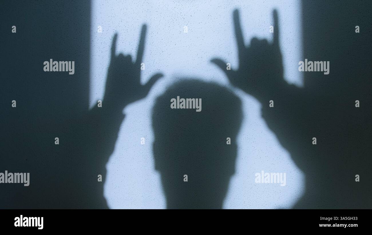 Rock Hand Gesture Shadow Silhouette – Symbol of Music, Energy, and ...