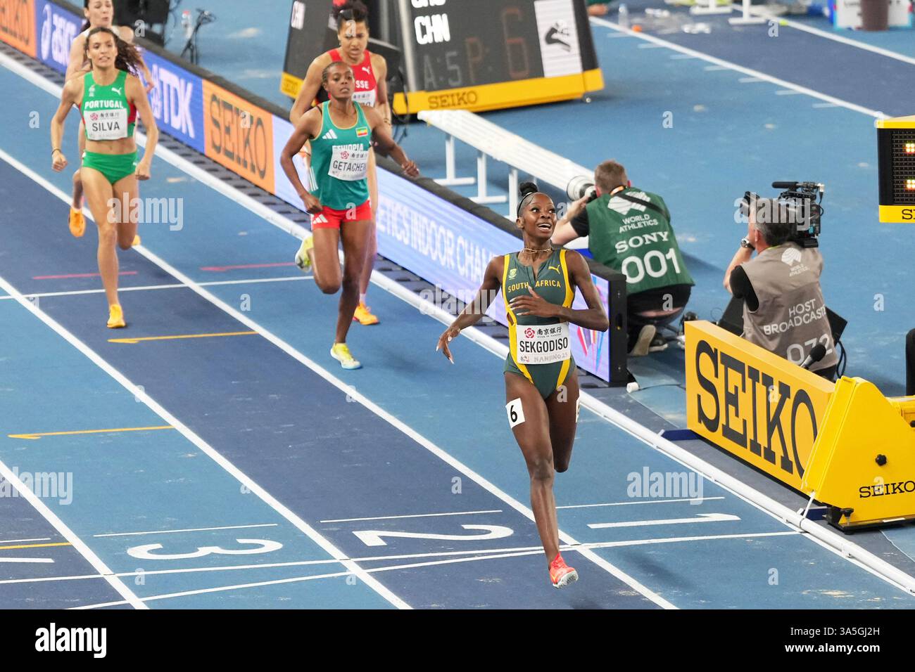 Prudence Sekgodiso, of South Africa, crosses the finish line to win the ...