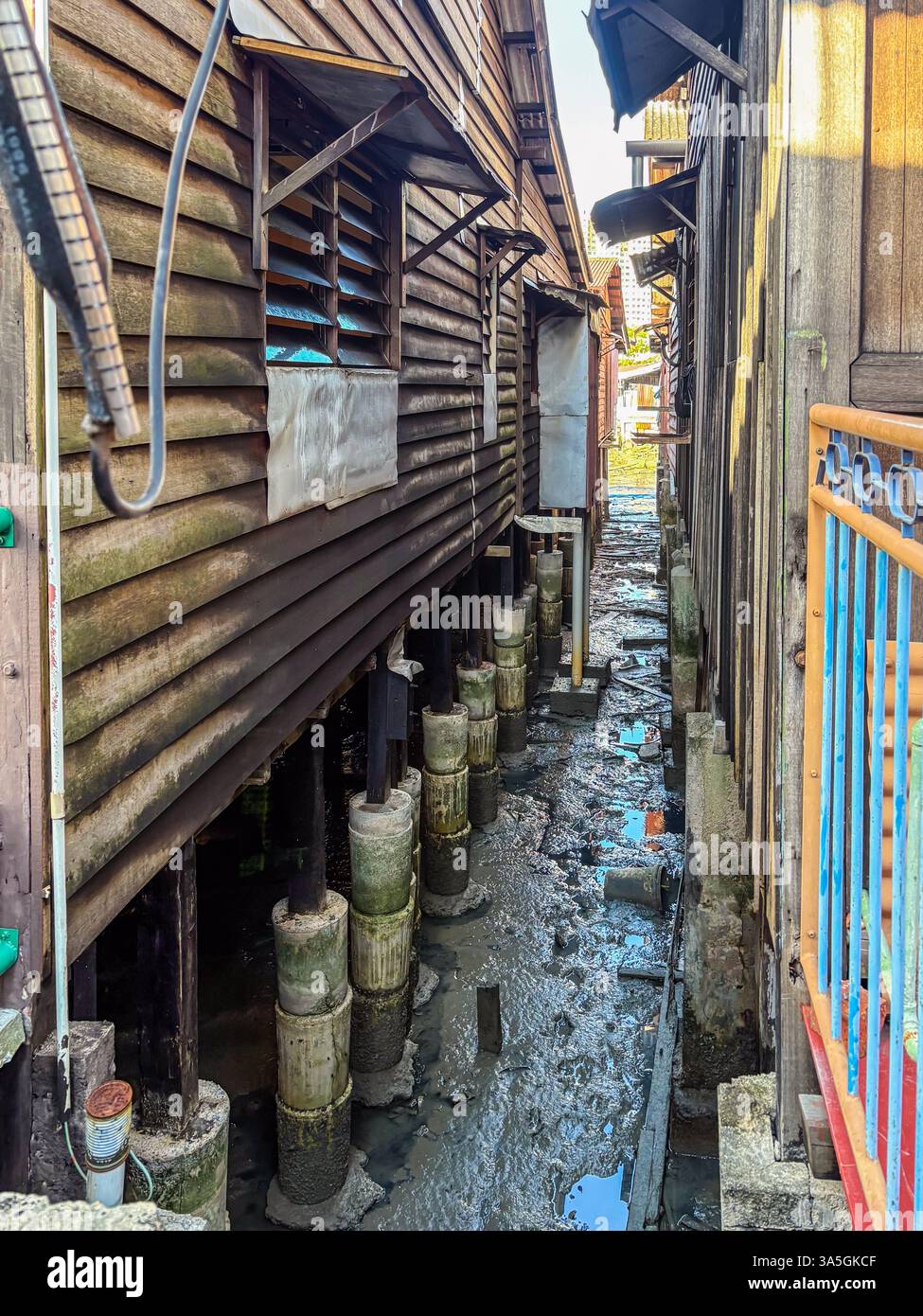 View underneath the waterfront houses on stilts at Chew Jetty, Weld ...
