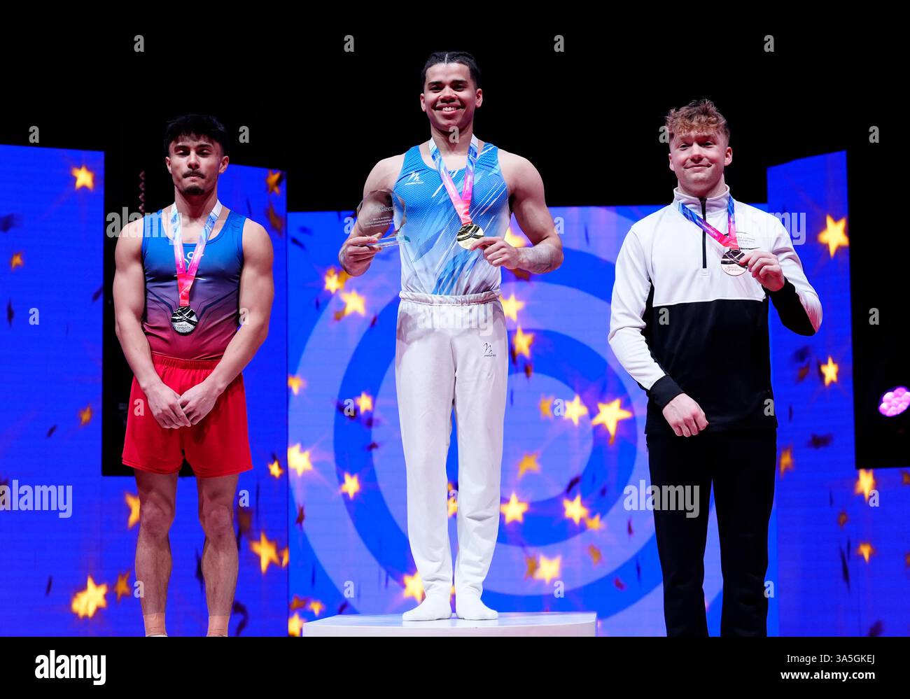 (left to right) Jake Jarman with the silver medal, Jamie Lewis with ...