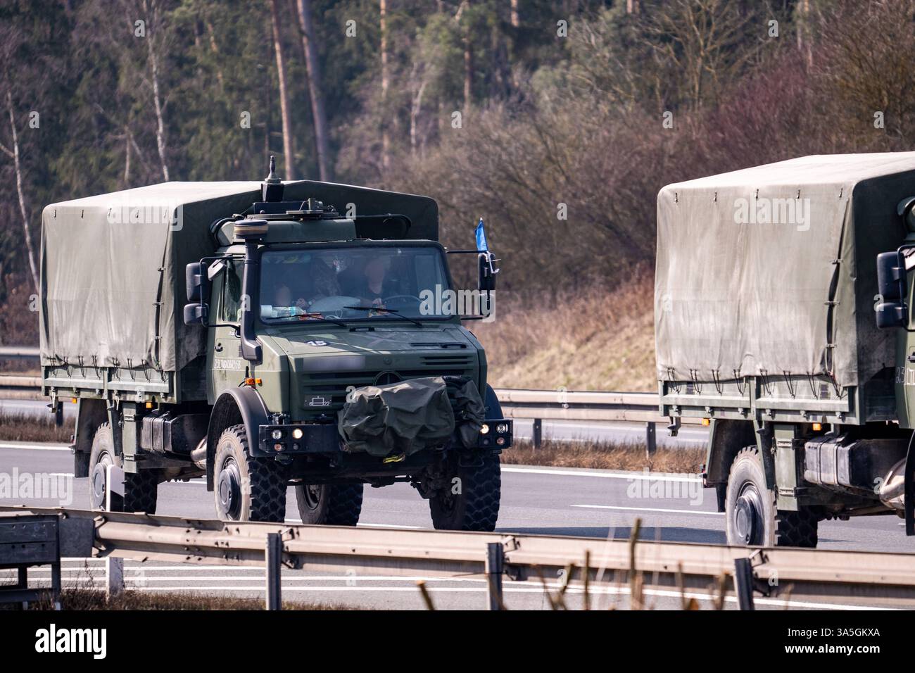 A9, Germany - March 23, 2025: Two military trucks with camouflage ...