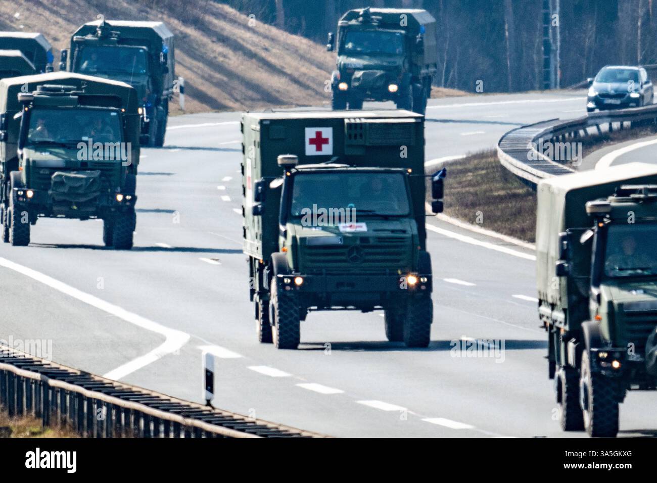 A9, Germany - March 23, 2025: Medical vehicle with red cross drives at ...