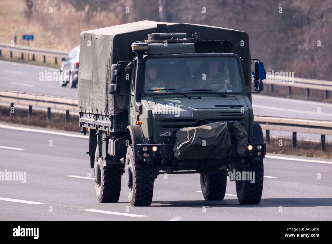 A9, Germany - March 23, 2025: A military truck HGV with a camouflage ...