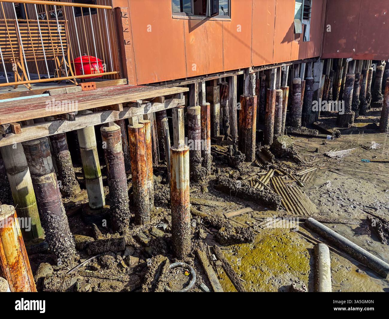 The ground and stilts under the waterfront houses at the Lee clan Jetty ...