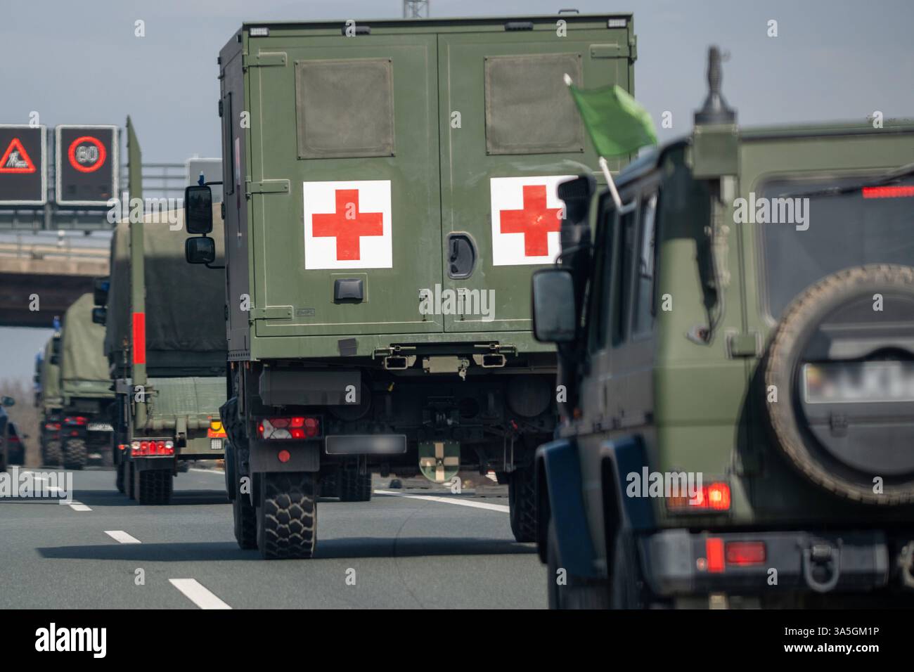 A9, Germany - March 23, 2025: A camouflaged military convoy is driving ...