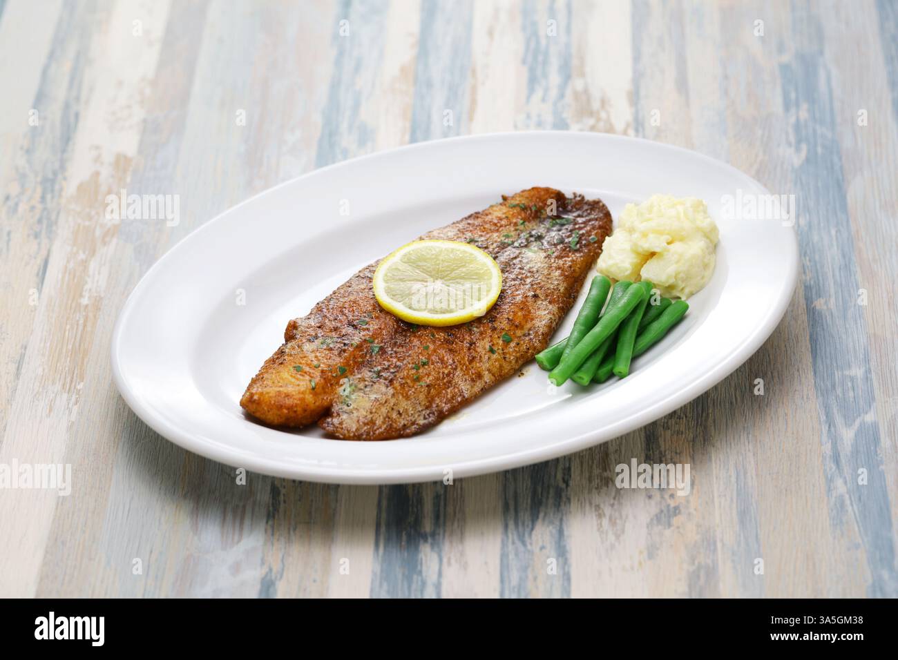 basa fish fillet cajun spiced meunière Stock Photo - Alamy
