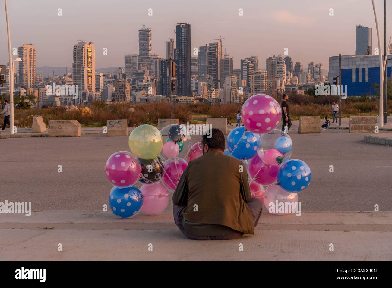 The Lebanese man with colorful balloons enjoying the panorama view of ...