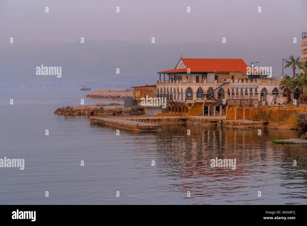 The house on Beirut waterfront, Lebanon, with arched windows, a red ...