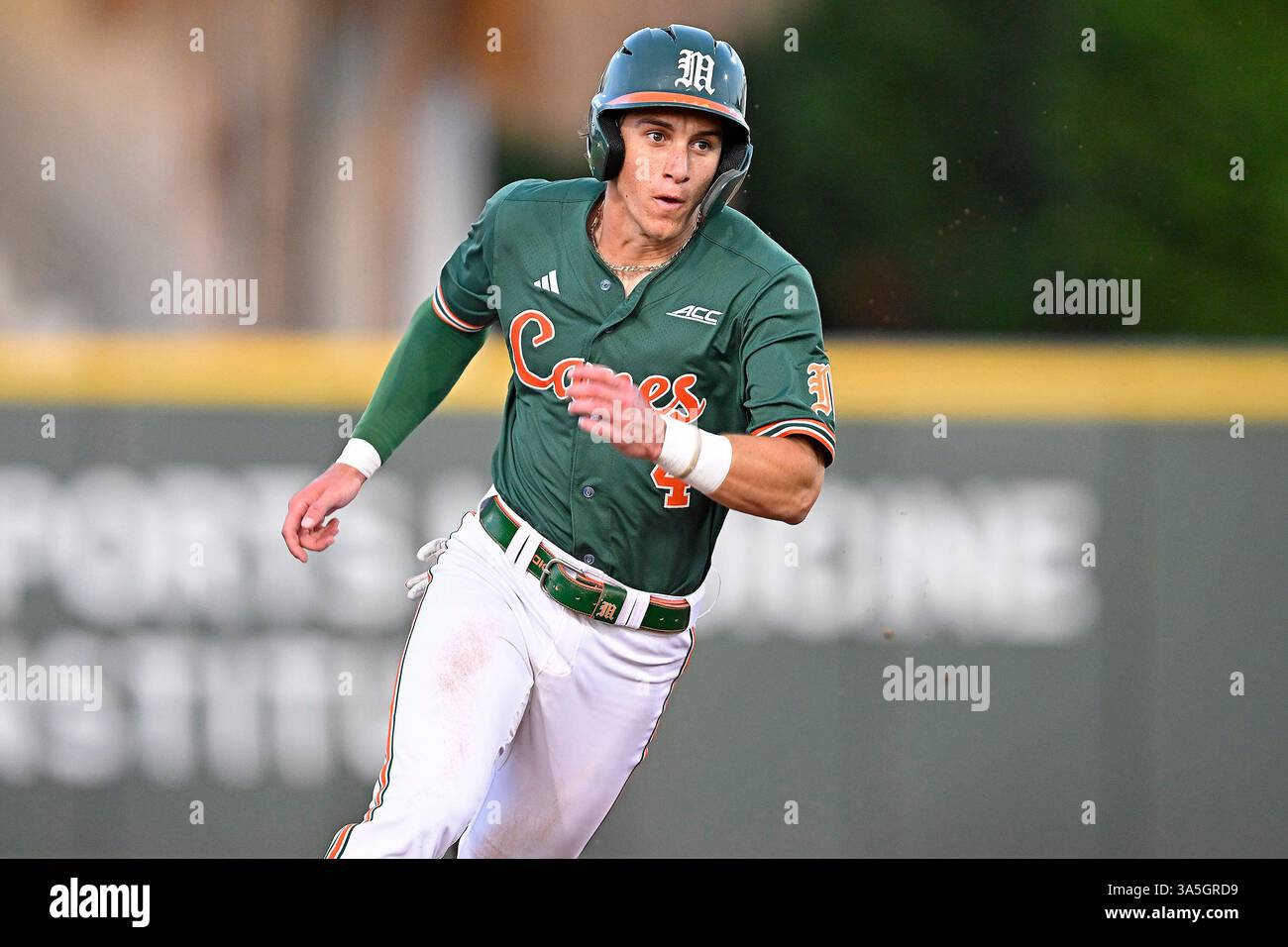 CORAL GABLES, FL - MARCH 22: Miami infielder Jake Ogden (4) runs to ...