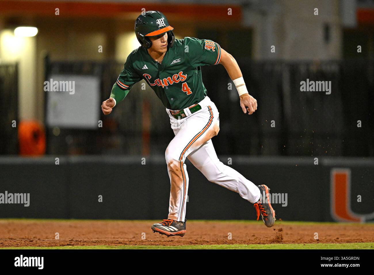 CORAL GABLES, FL - MARCH 22: Miami infielder Jake Ogden (4) runs to ...