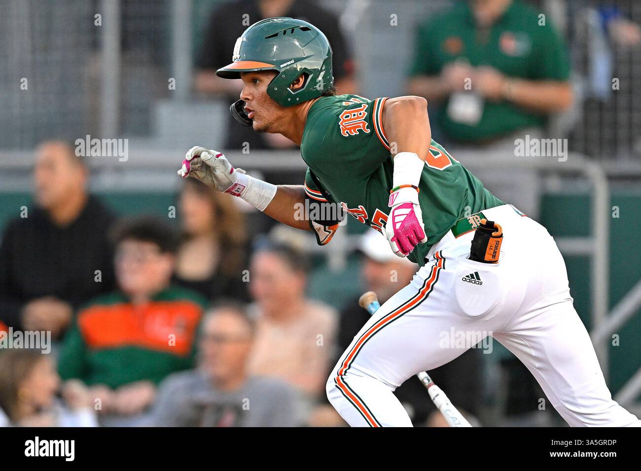 CORAL GABLES, FL - MARCH 22: Miami outfielder Fabio Peralta (37) runs ...