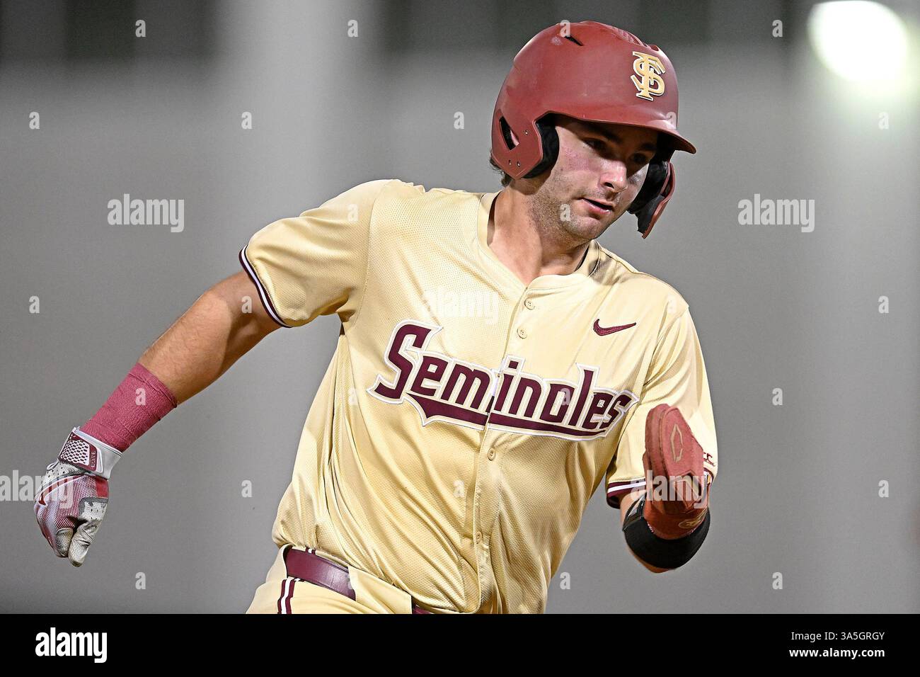 CORAL GABLES, FL - MARCH 22: FSU catcher Hunter Carns (25) runs to ...
