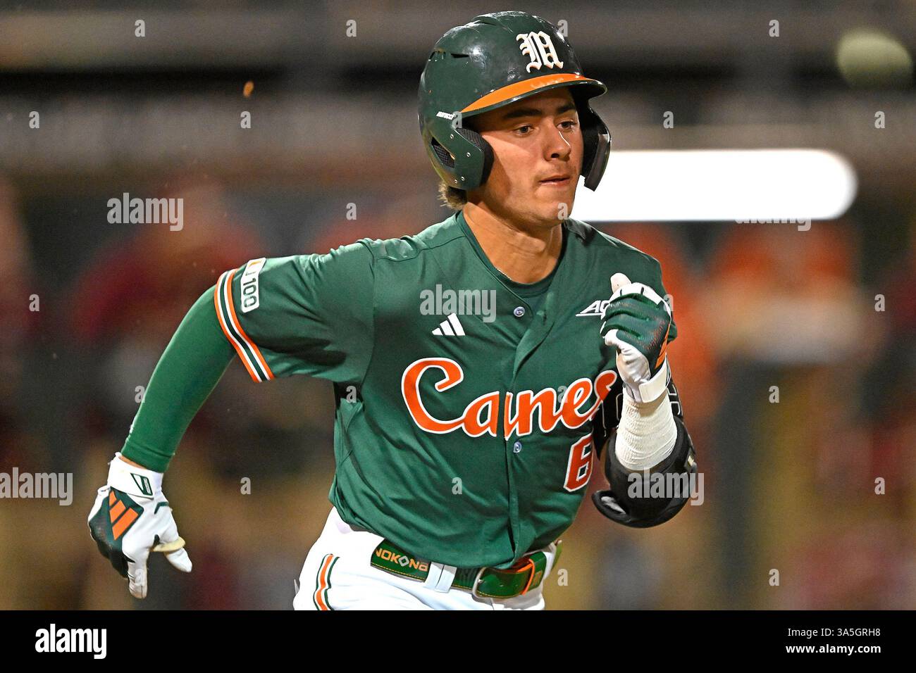 CORAL GABLES, FL - MARCH 22: Miami infielder Brandon DeGoti (6) runs to ...