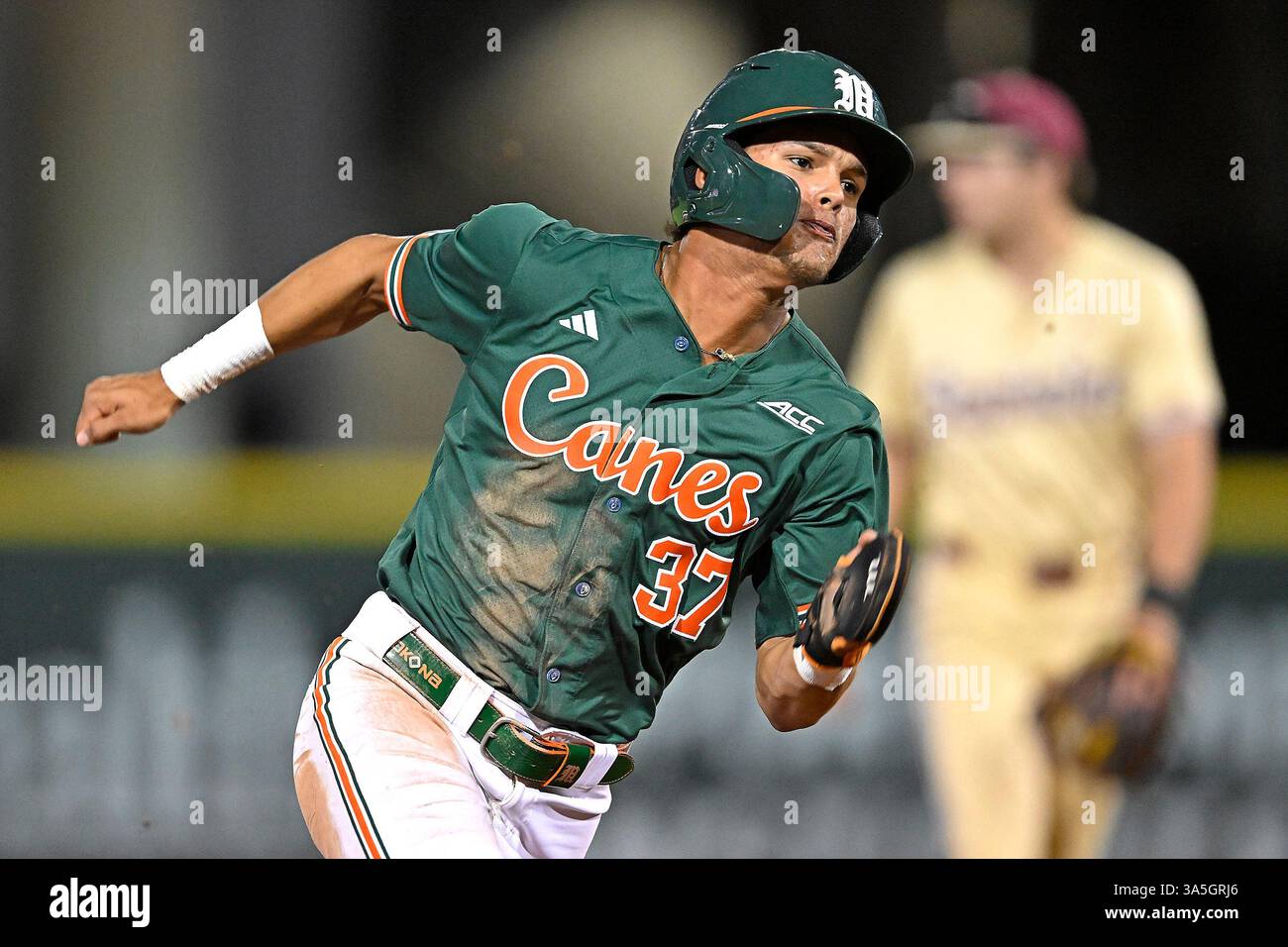 CORAL GABLES, FL - MARCH 22: Miami outfielder Fabio Peralta (37) runs ...