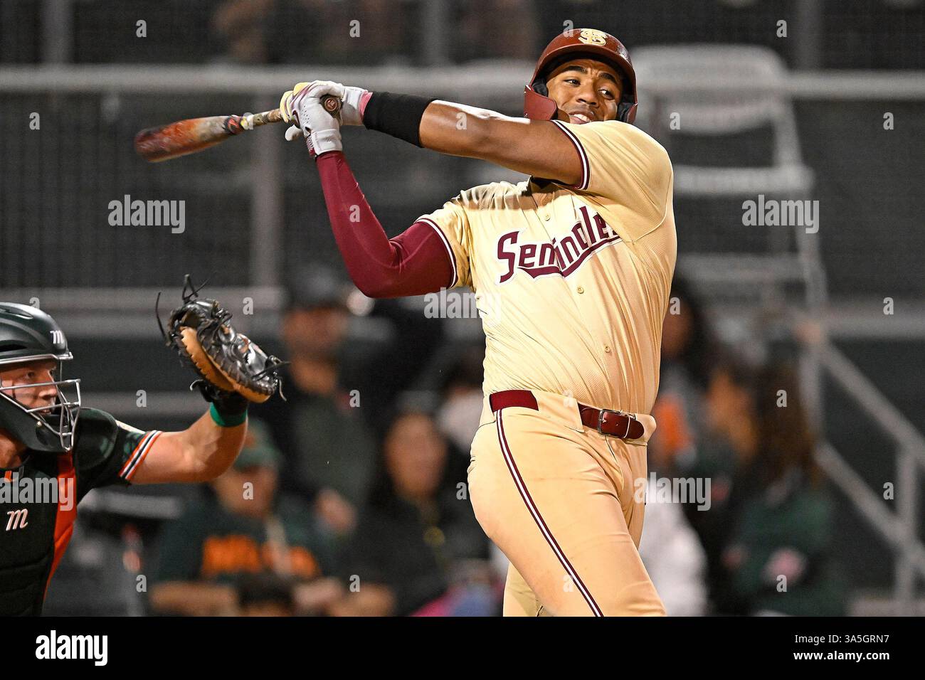 CORAL GABLES, FL - MARCH 22: FSU first baseman Myles Bailey (12) bats ...