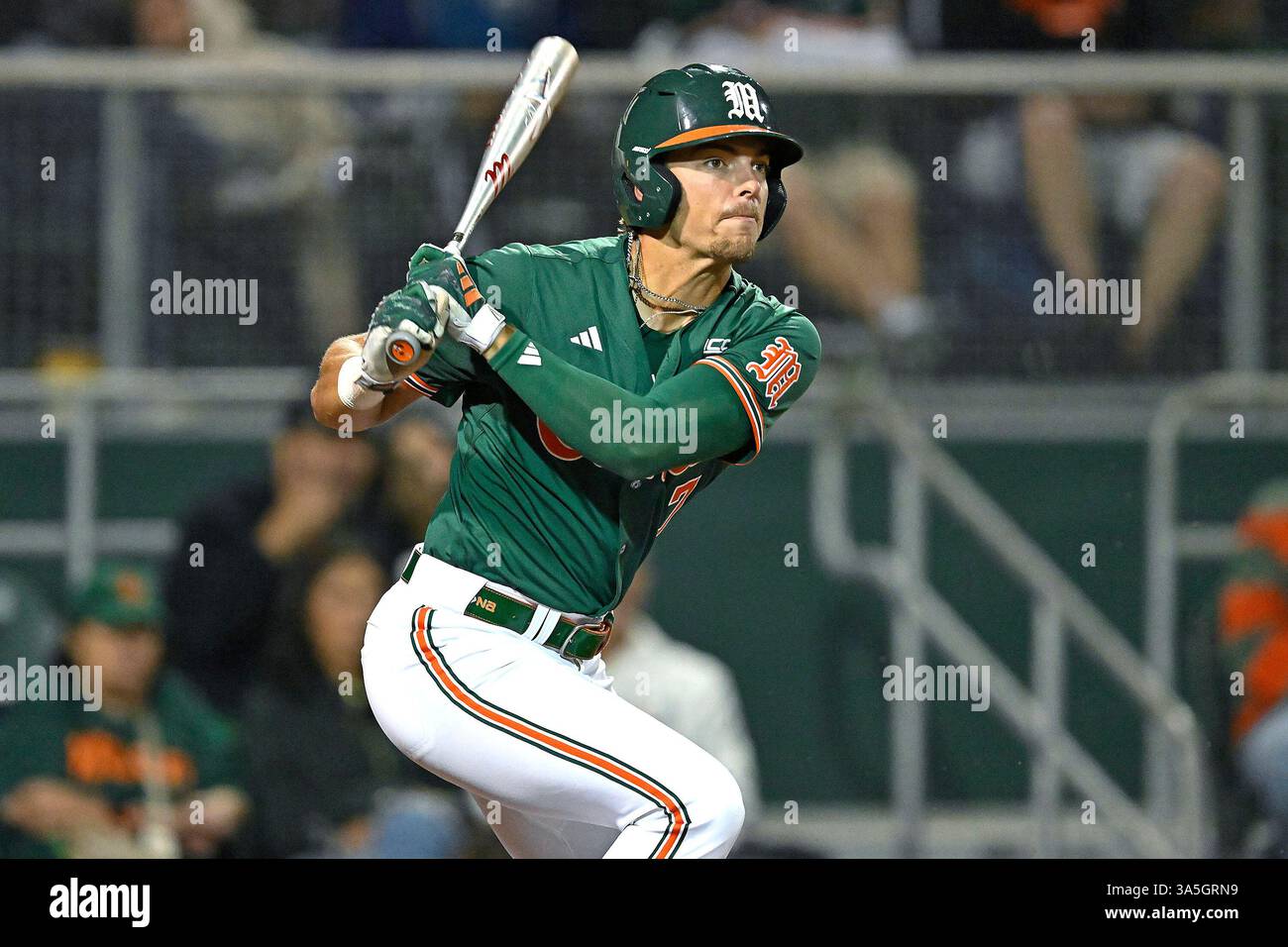 CORAL GABLES, FL - MARCH 22: Miami outfielder Max Galvin (7) bats in ...