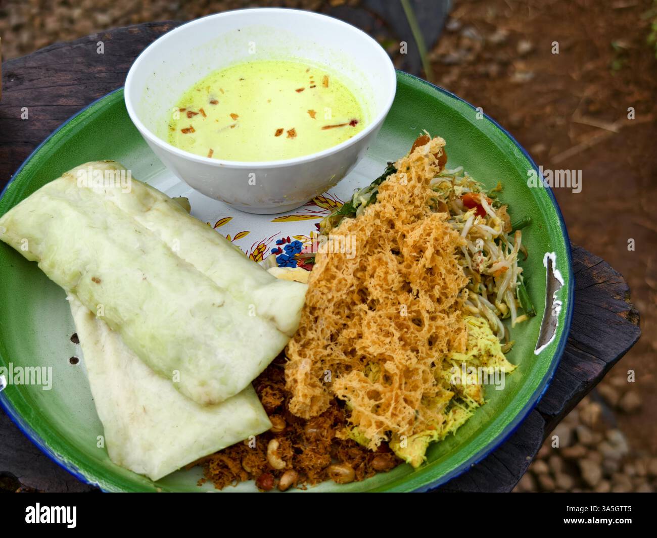 Entil Pupuan, a traditional Balinese dish, consists of rice cake ...
