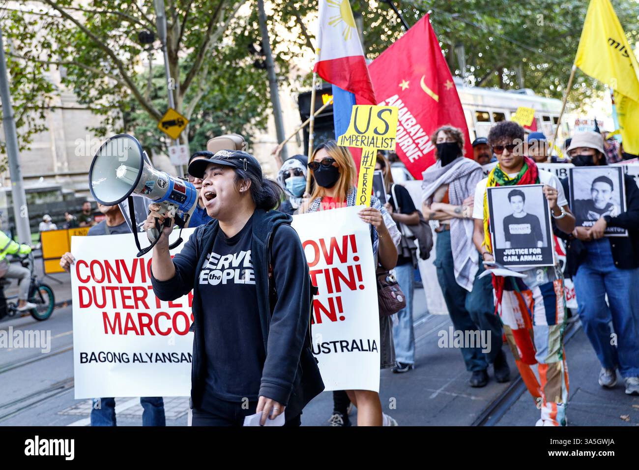 A Protester shouts slogans during the rally. A rally in Melbourne ...