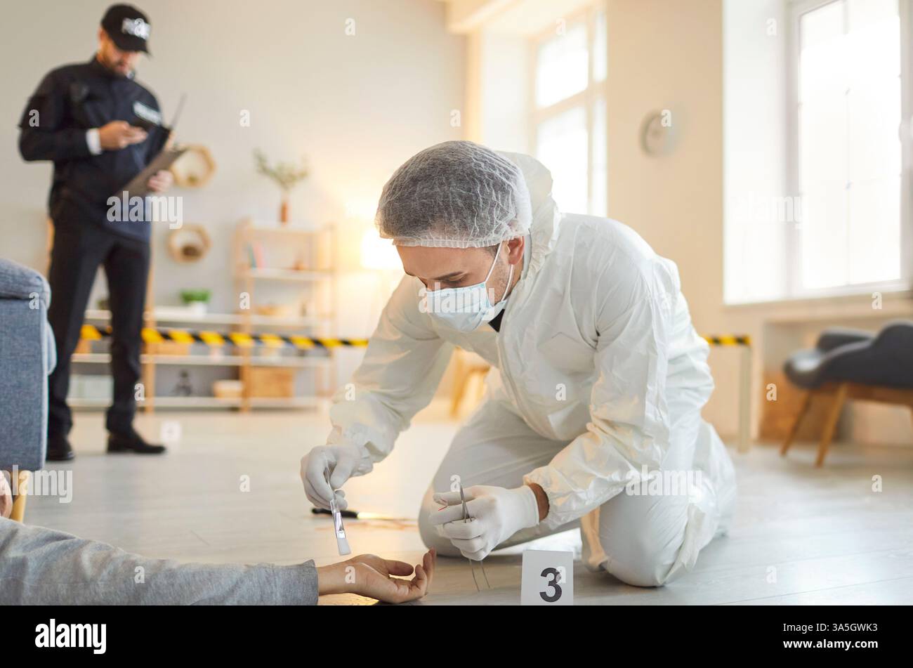 Forensic specialist analyzing evidence on dead body at crime scene ...