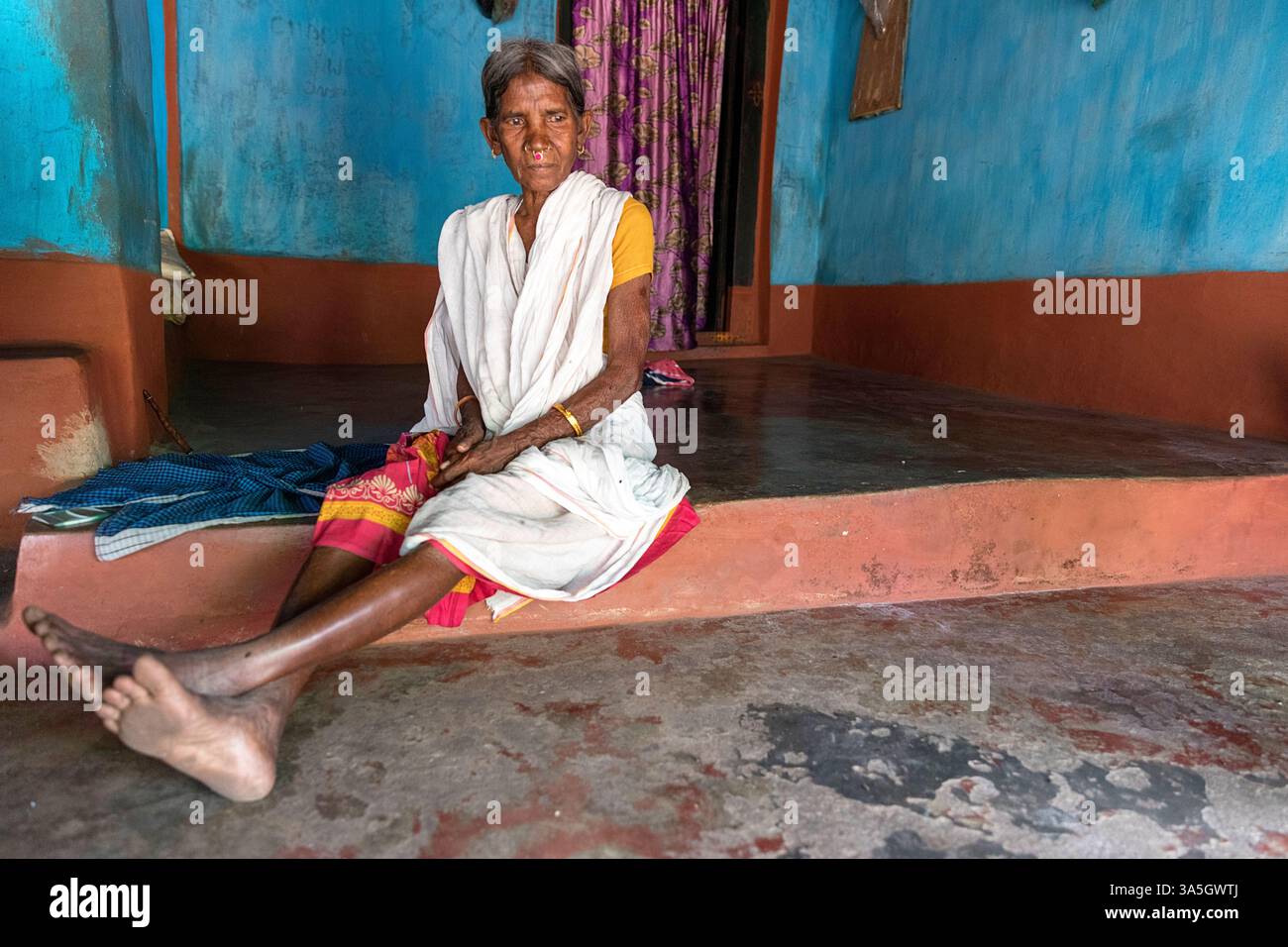 Woman wearing colourful traditional indian clothes sari sitting in ...